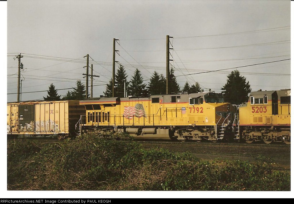 UP 7792 pulls into the north UP Eugene yard as the third unit on this manifest train.